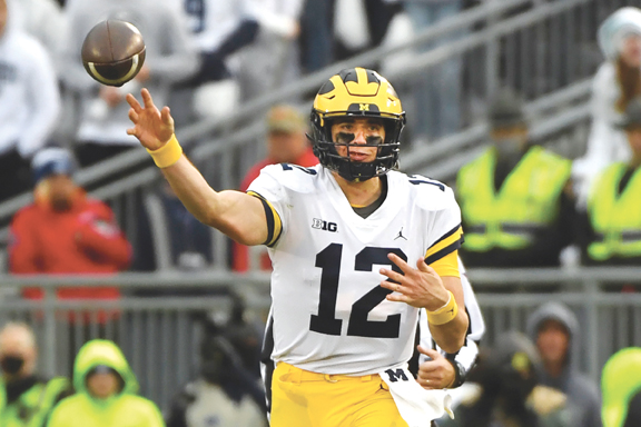 Head coach Jim Harbaugh splitting Michigan Wolverines’ quarterback duties for now between Cade ...